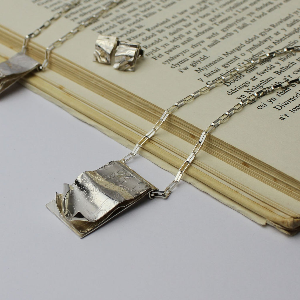 Silver jewellery inspired by pages of a book – Mari Thomas Jewellery